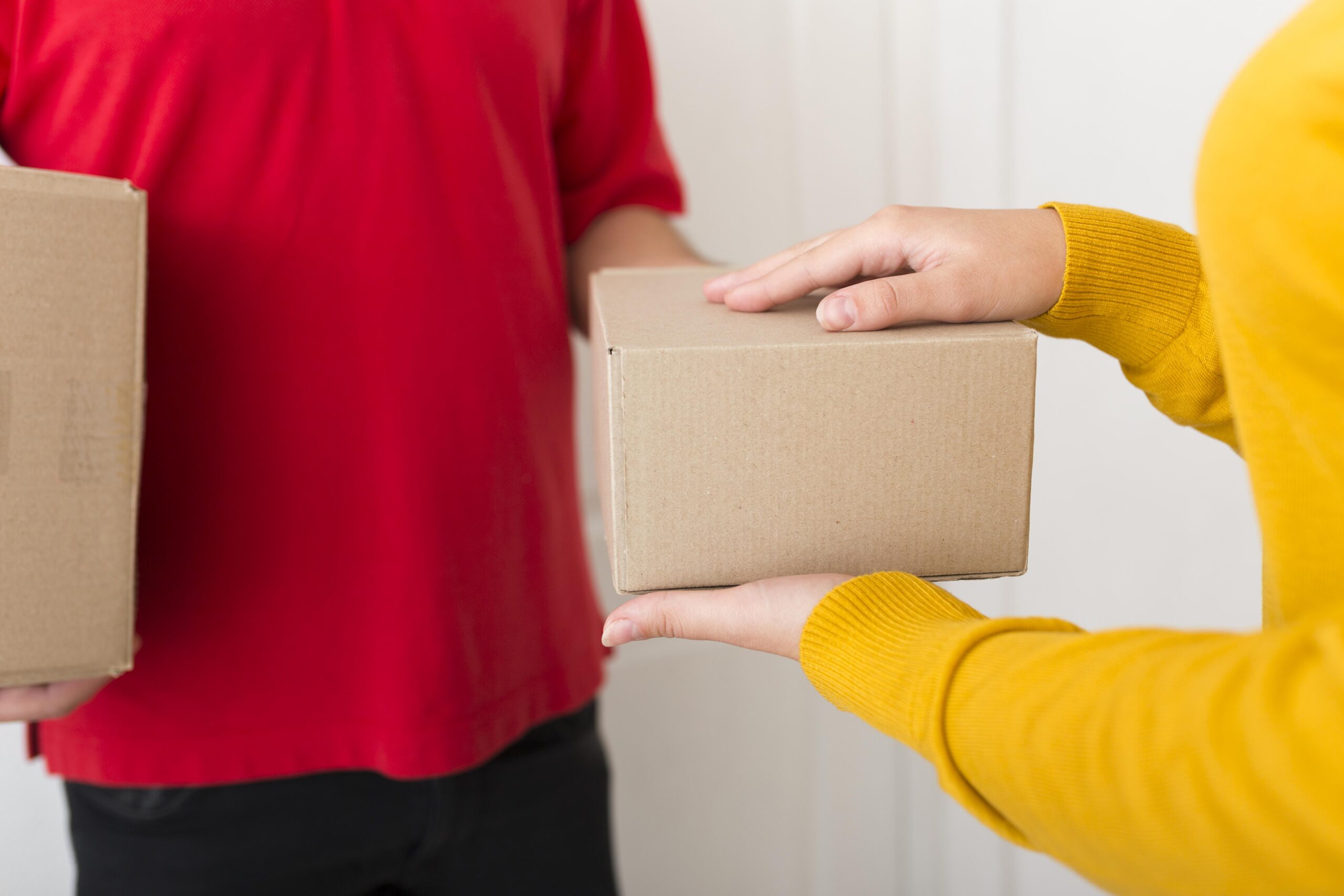 woman-taking-package-from-delivery-man - Import Anything Philippines